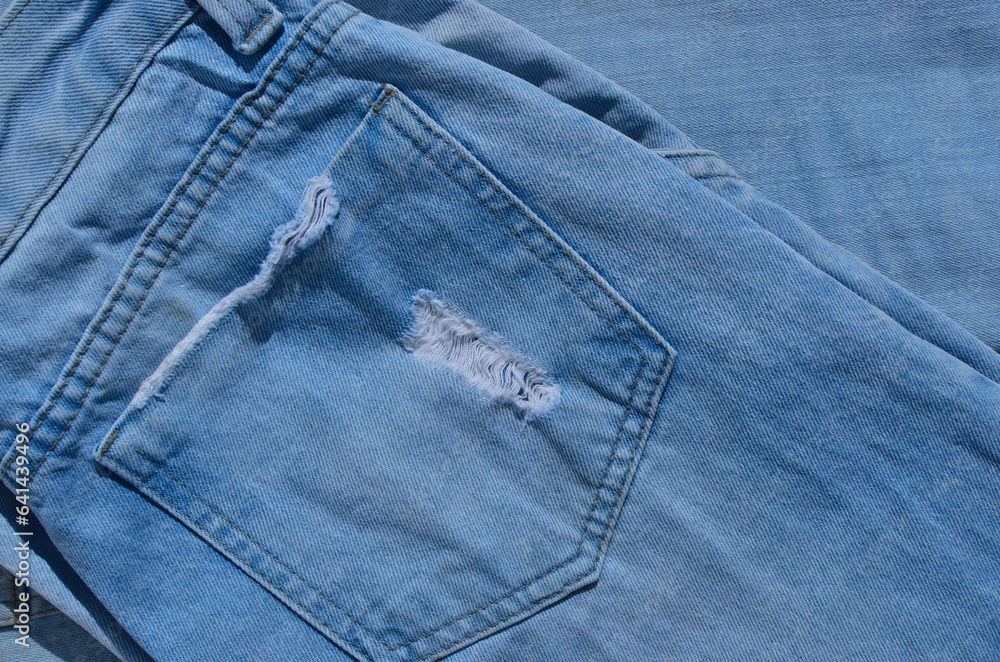 Focus on the stripped torn detail in jeans, bringing a casual and ...