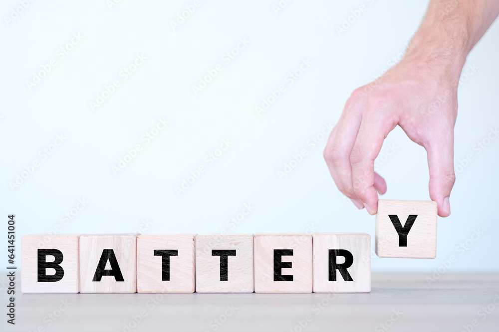 Man ordering Battery word on wooden block cubes, power or electrical ...