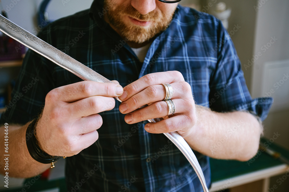 Craftsman making leather bag Stock Photo | Adobe Stock