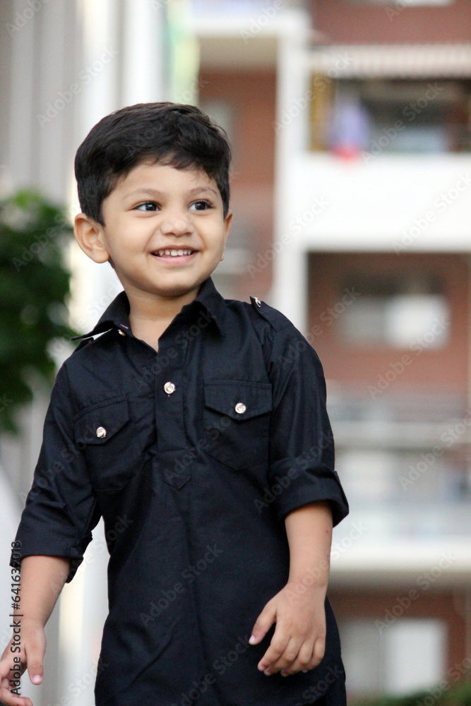 Cute little toddler boy in Black Pathani outfit. Adorable boy is ...
