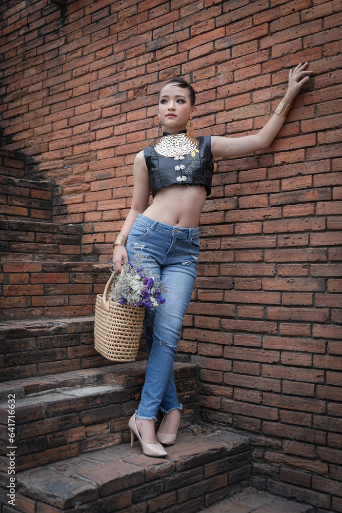 Pretty teenage young Asian women in a modern dress fashion contemporary ...