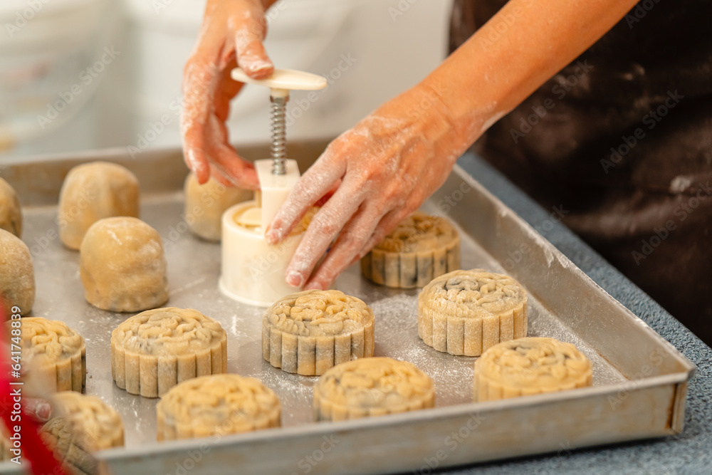 Mooncake making process. A mooncake is a Chinese bakery product ...