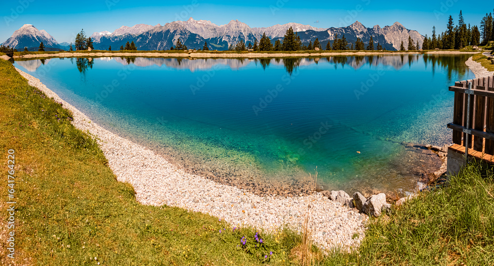 High resolution stitched alpine summer panorama with reflections at ...