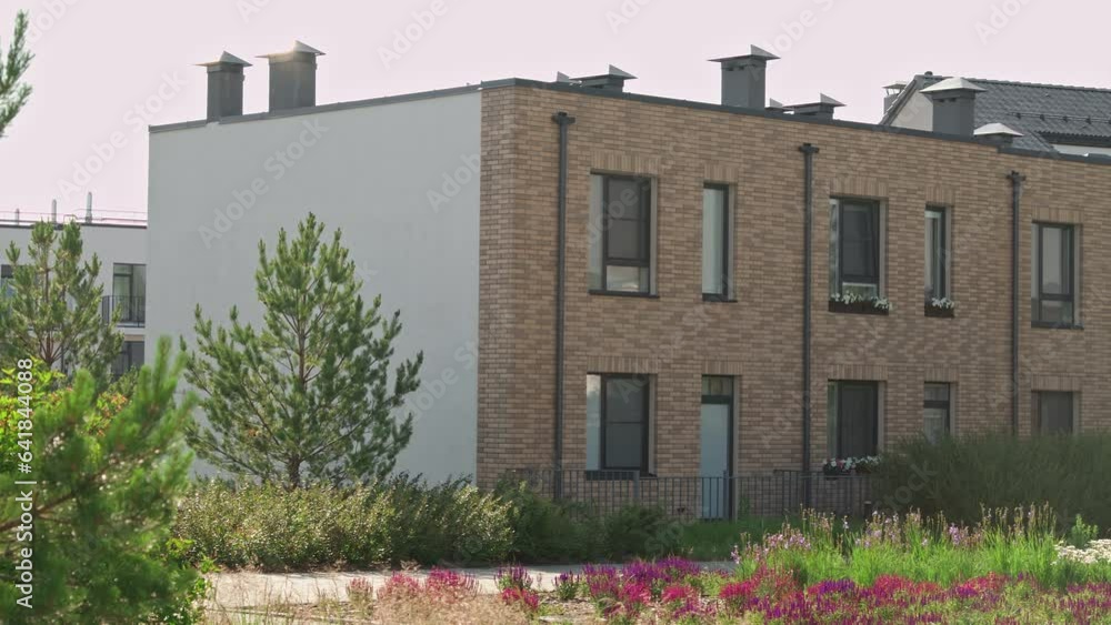 Establishing shot of modern two-storey multifamily residential house ...