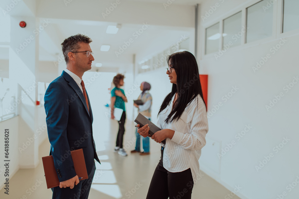 Business colleagues engage in a knowledge-sharing conversation during a ...