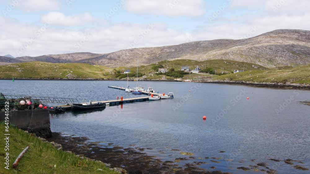 Static shot of the harbour on the Isle of Scalpay, near the Isle of ...