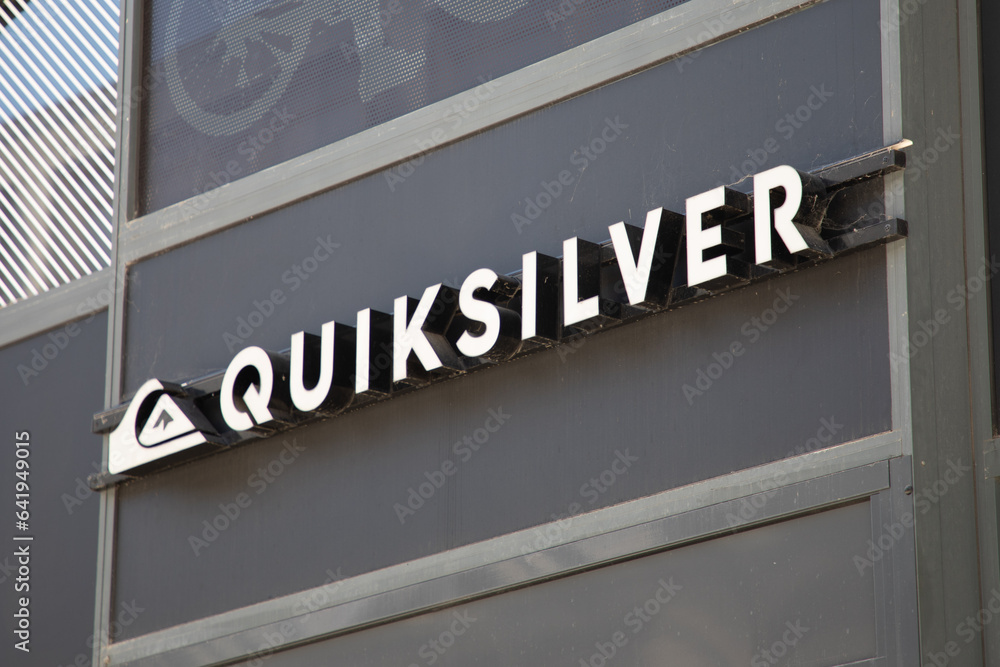 Quiksilver sign text shop and brand store logo on building entrance ...