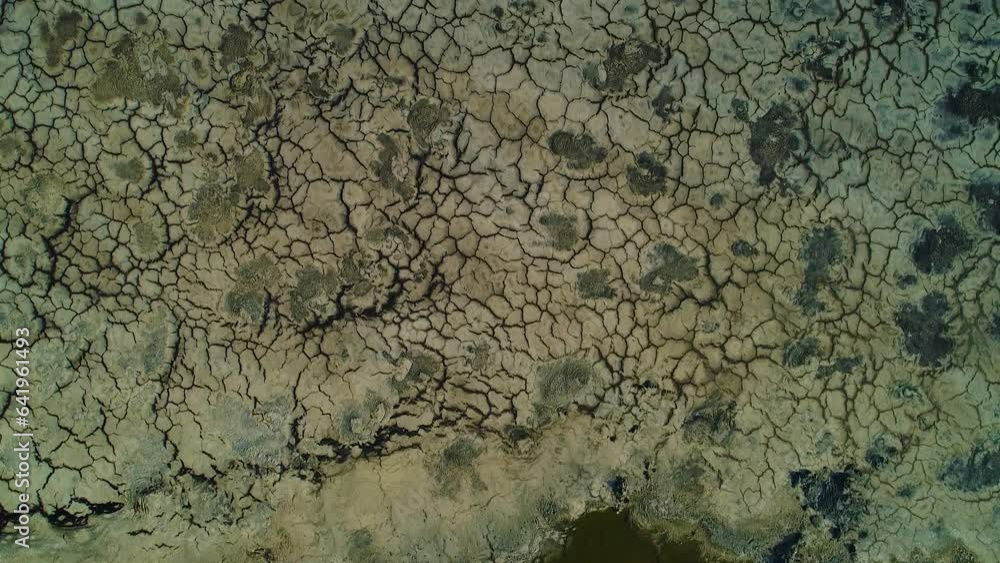 Drone top down view of cracked mud bank asphalt lake in willemstad ...