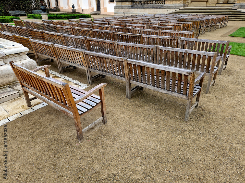 outdoor theater auditorium. Benches stacked in rows. adjacent. There is ...