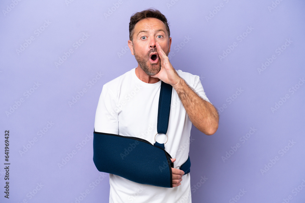 Middle age caucasian man with broken arm and wearing a sling isolated ...