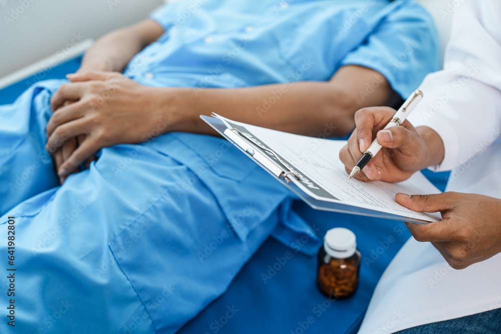 Urinary tract cancer specialists examine patients for prostate cancer ...