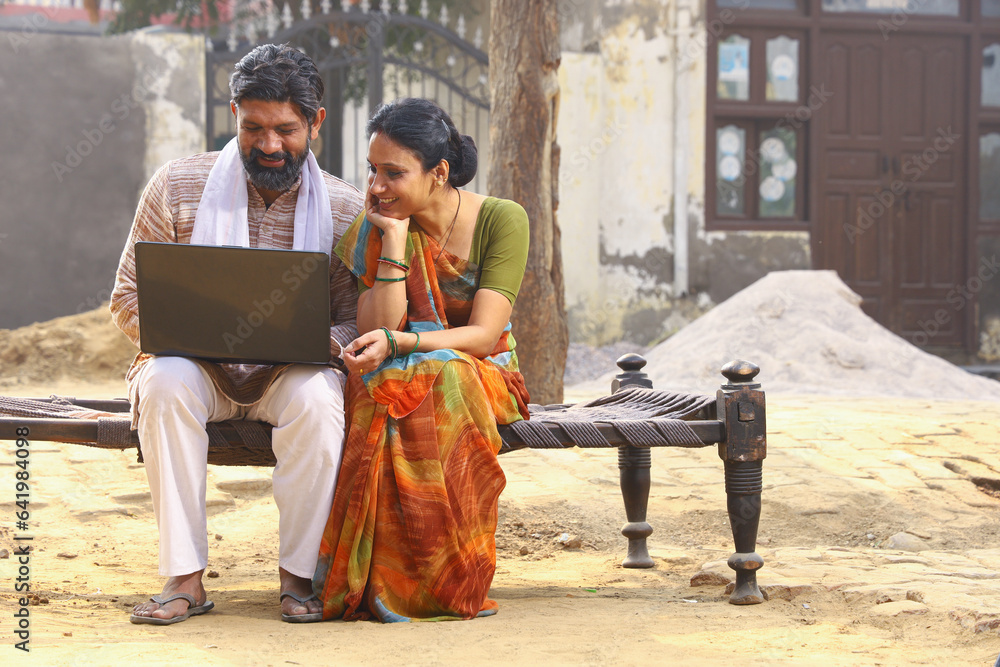 Happy Indian Rural family in village. Rural couple sitting together ...