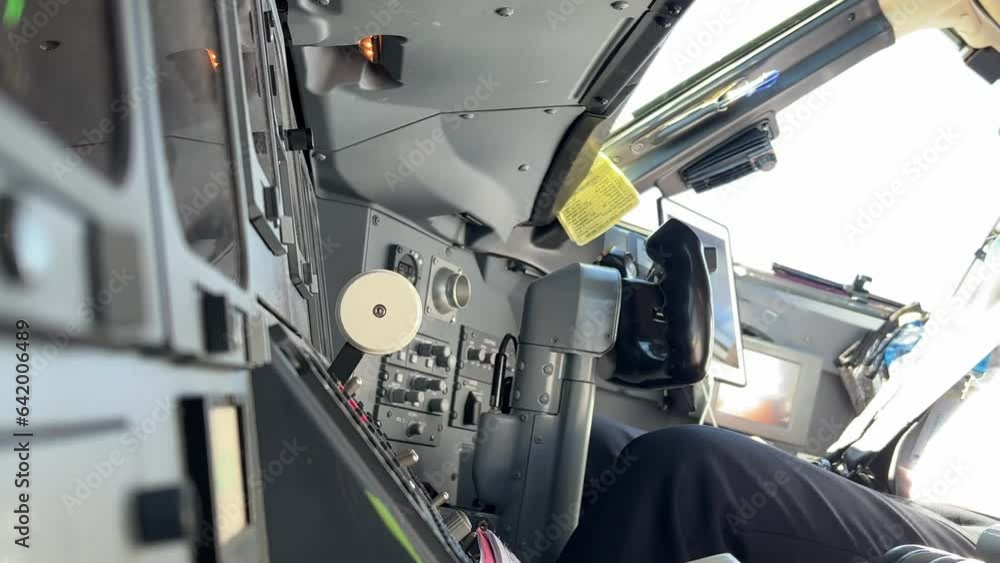 Scene in the airplane cockpit showing the pilot lowering the landing ...