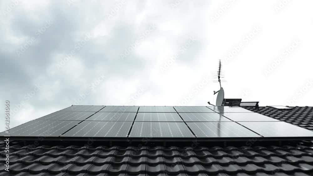 Photovoltaic rooftop or solar panels rooftop with reflection of the Sun ...