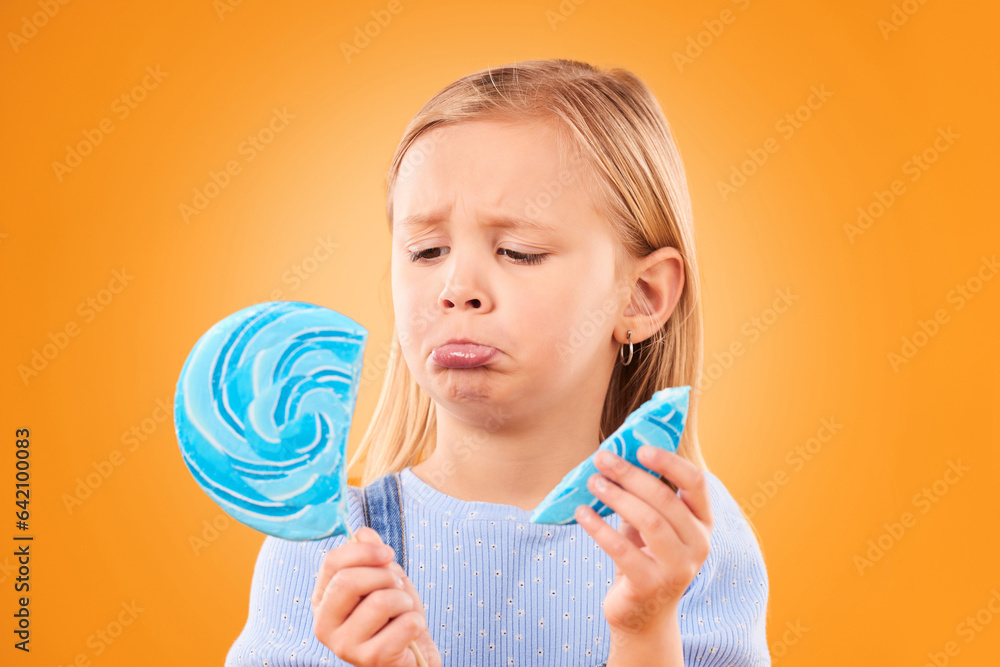 Children, candy and a sad girl with a broken lollipop on an orange ...