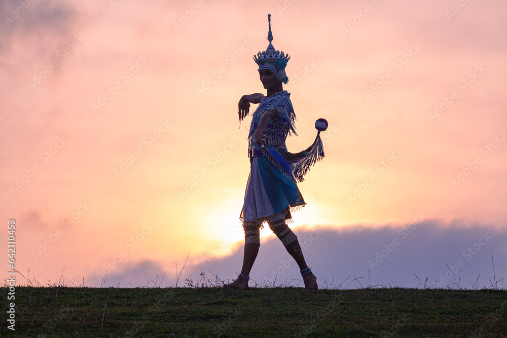 Nora performs dance moves in the field at sunset.beautiful sky ...
