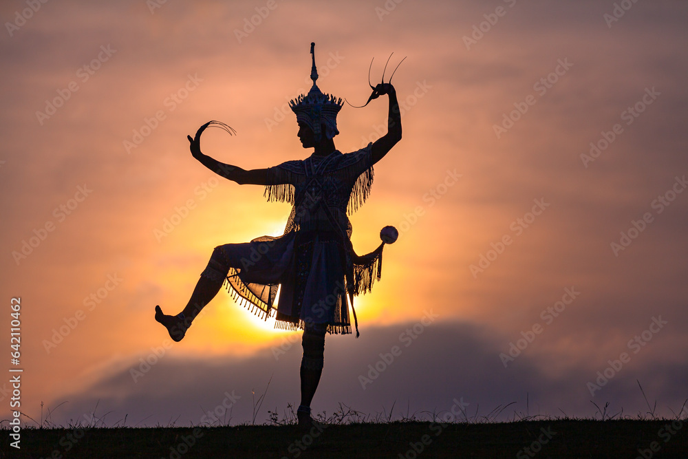 Nora performs dance moves in the field at sunset.beautiful sky ...