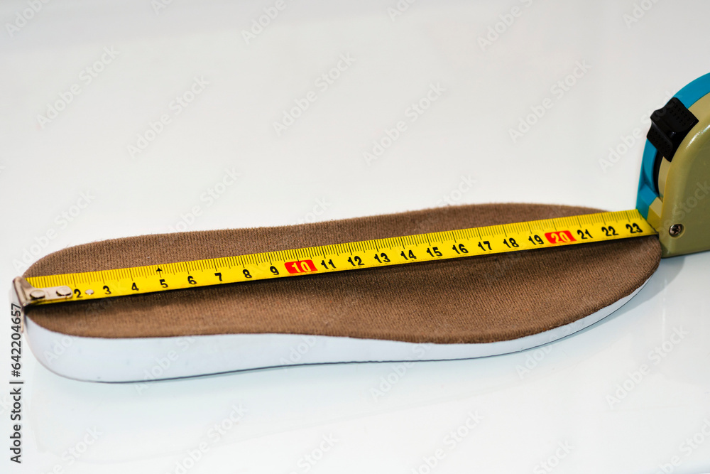 Shoe size measurement. Measure tape measure insoles. shoes size concept ...