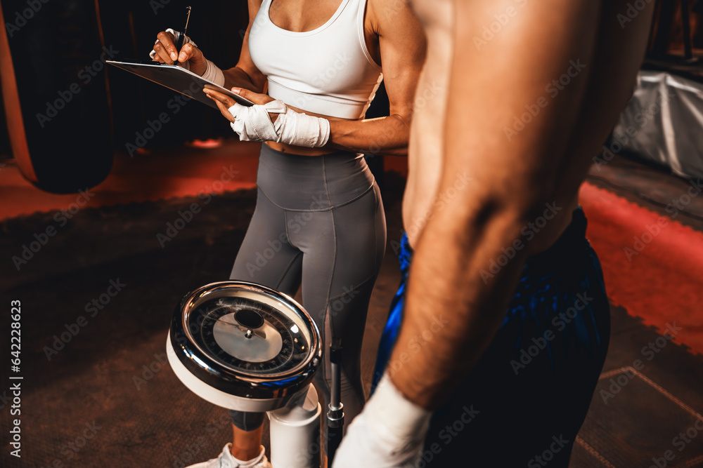 Boxer step on weight scale for boxing class designation by weight ...