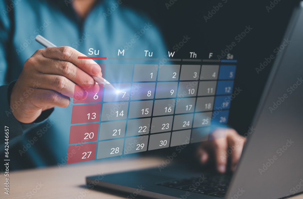 Businessman use computer and touch virtual calendar screen. Make ...