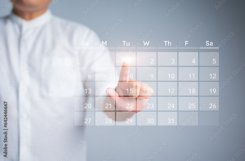 Businessman touching virtual calendar screen interface. Make ...