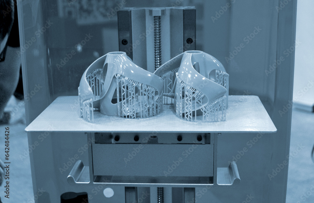 Printed models on 3D printer close-up. Objects printed on photopolymer ...