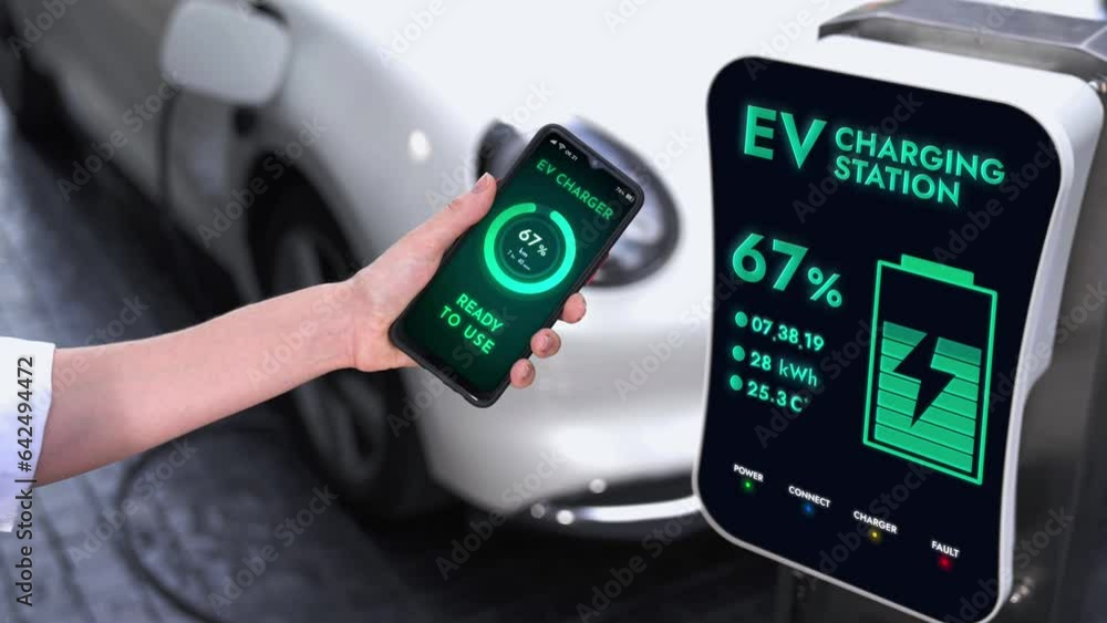 Businesswoman holding smartphone display battery status interface by ...