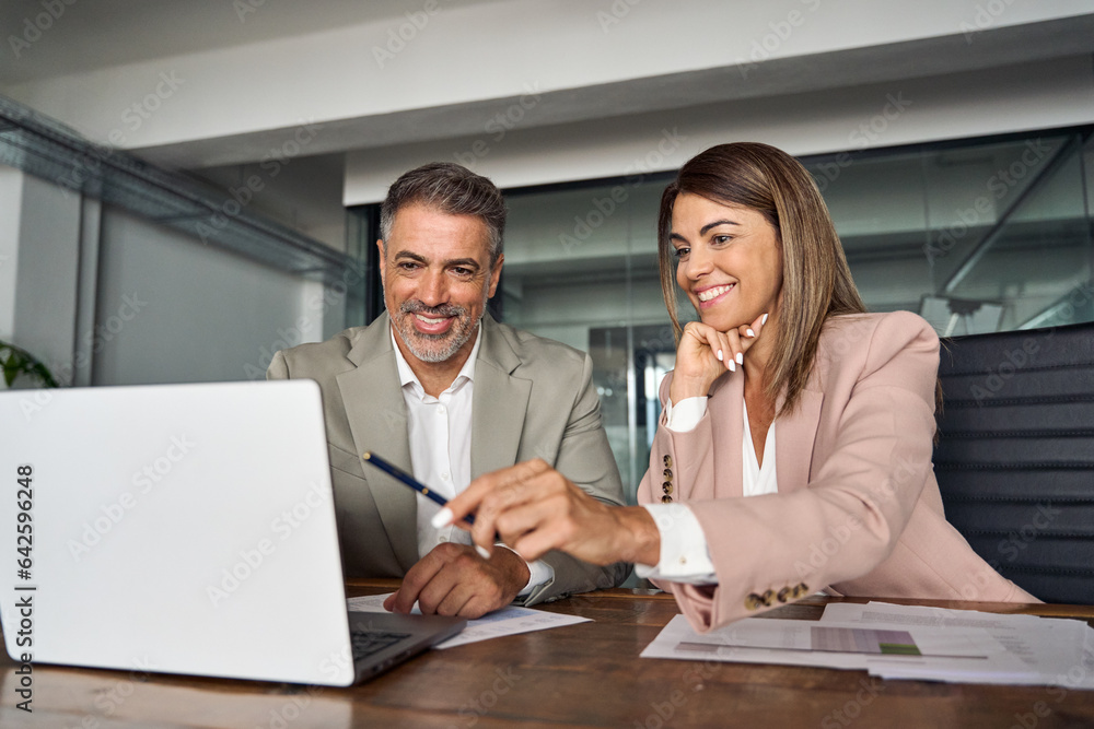 Female professional business manager consulting older Indian male ...