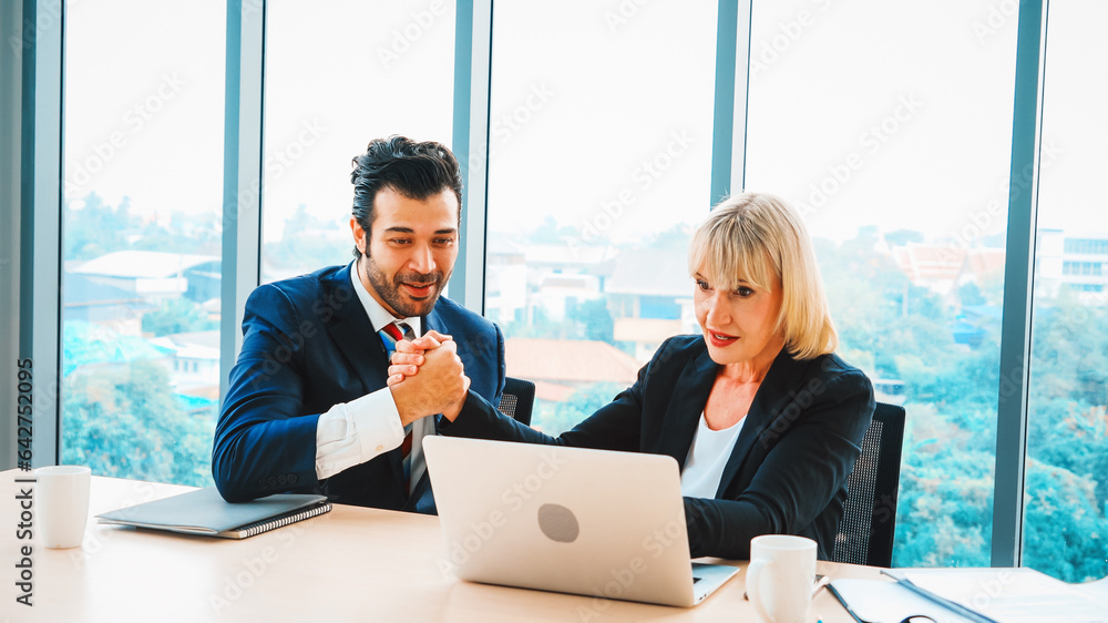 Two happy business people celebrate at office meeting room. Successful ...