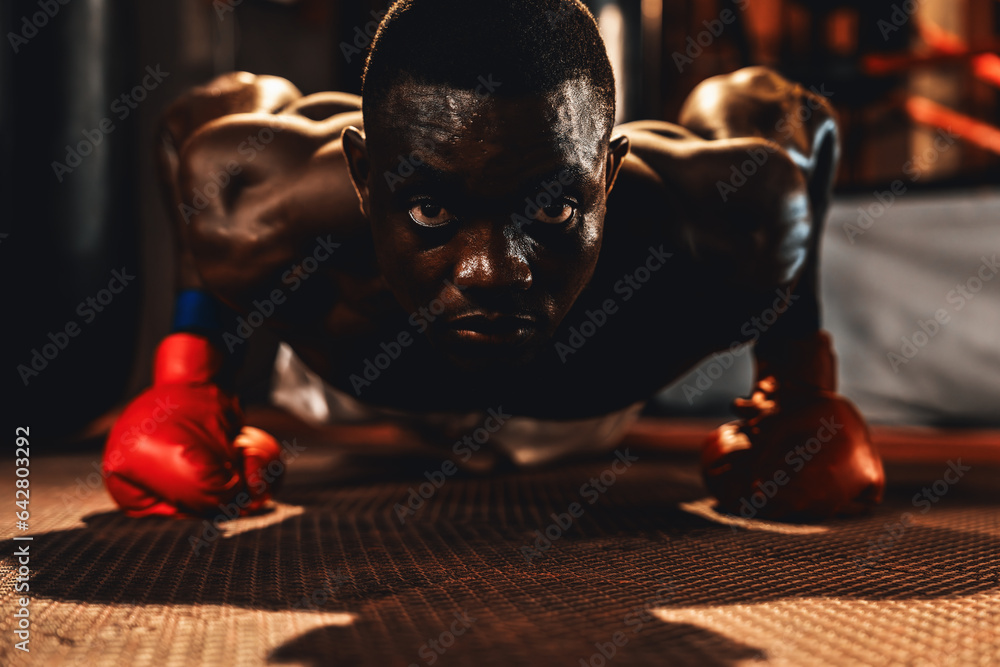 African American Black male boxer pushup and warmup before boxing ...