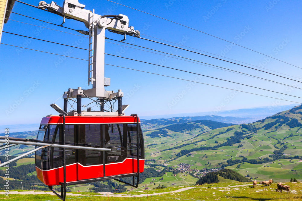Red cable car from Wasserauen to Ebenalp mountain in the Swiss Alps in ...