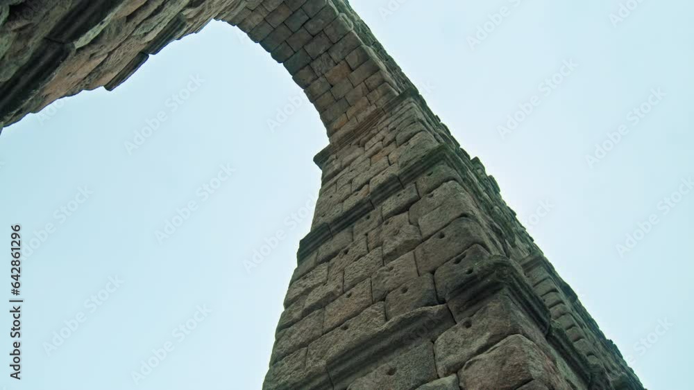 Curved arches of the Towering Roman Aqueduct of Segovia landmark ...