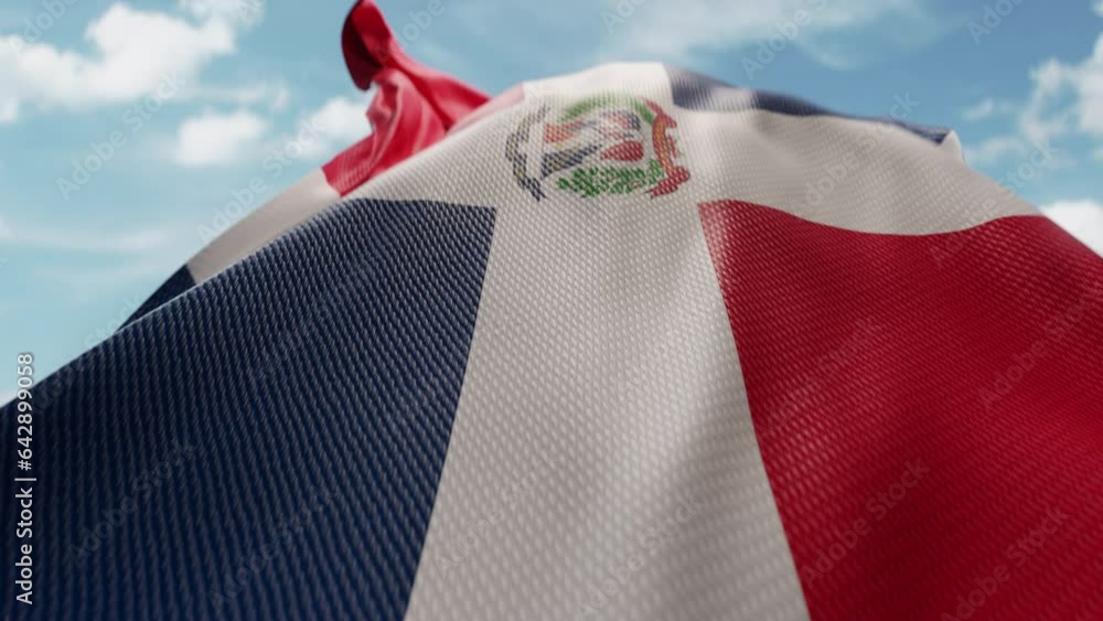 Wavy flag of Dominican Republic blowing in the wind in slow motion ...