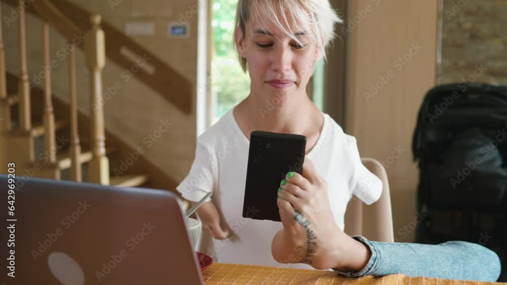 Female person with Phocomelia syndrome uses a mobile phone with her ...