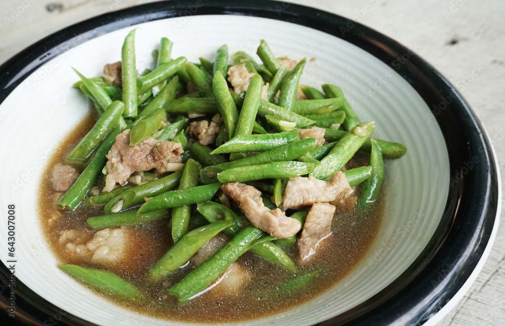 Stir fried long beans and oyster sauce and Pork. Food of Thailand has a ...