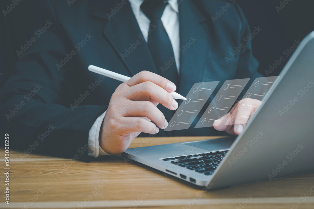 businessman using laptop doing online checklist survey, business ...