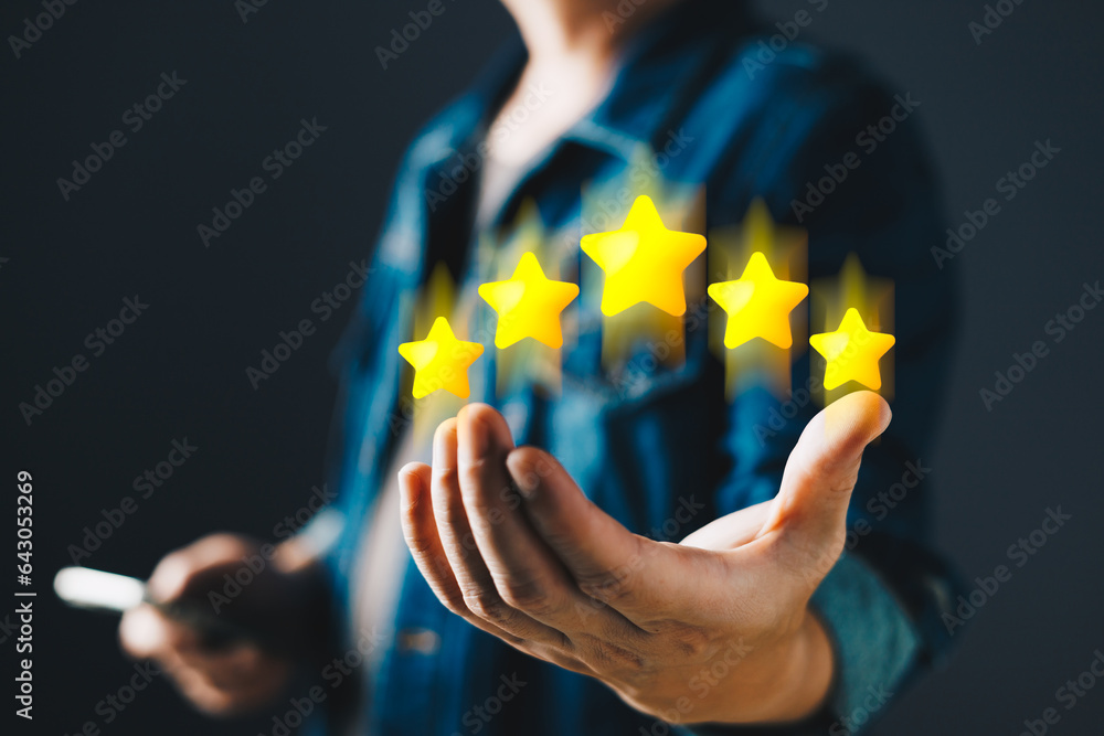 hand of customer or client holding the stars to complete five stars ...