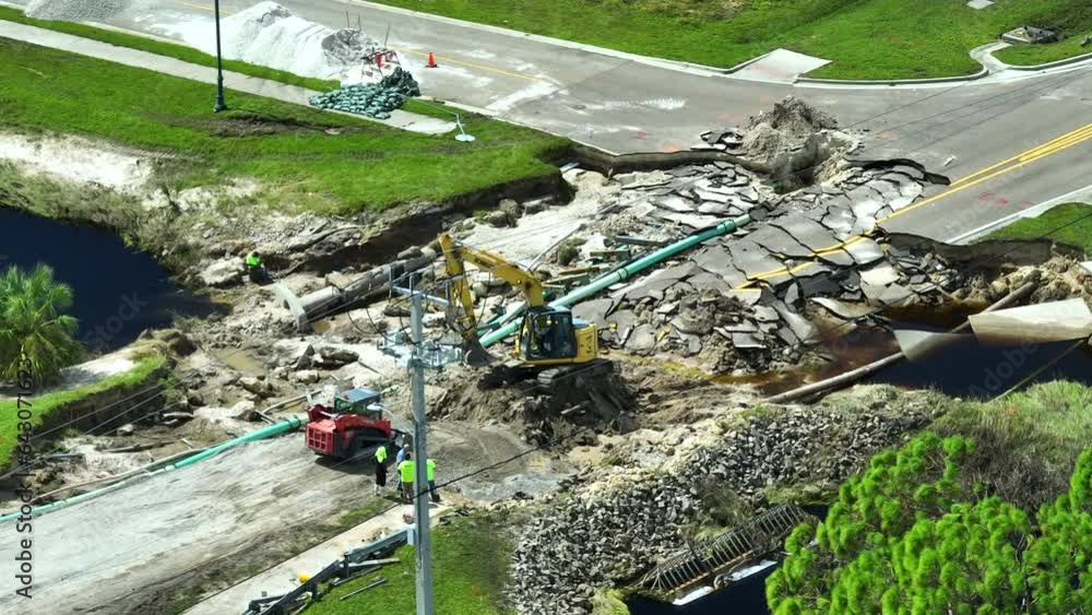Aerial view of reconstruction of damaged road bridge destroyed by river ...