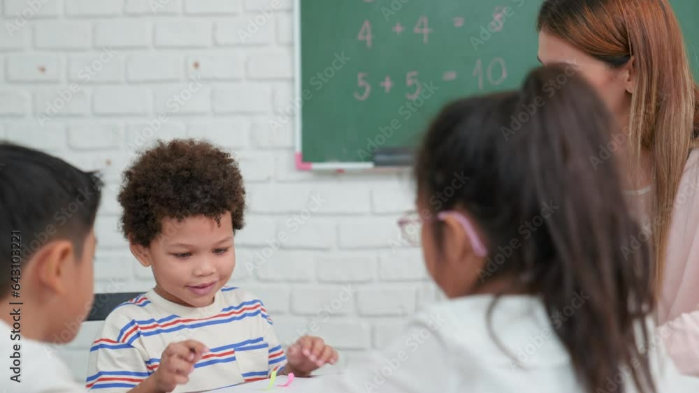 Multi-ethnic students of different nationalities learning together in a ...