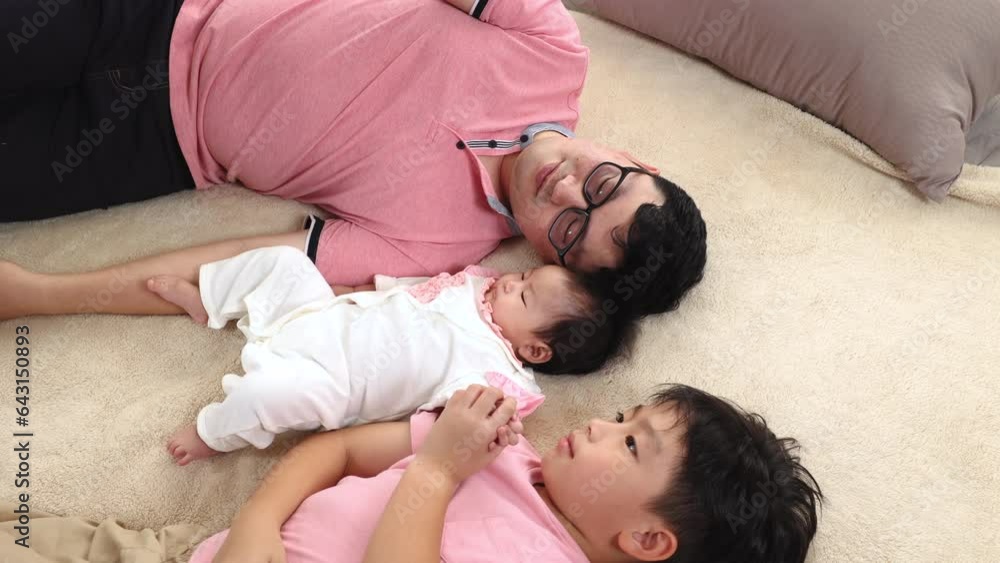 Happy Asian father with kids takes photo selfie on bed. Dad, newborn ...