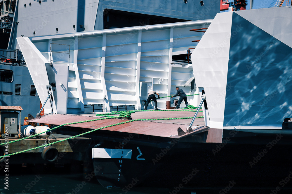 Car ferry on the water, car deck and upper deck, two cars and spaces ...