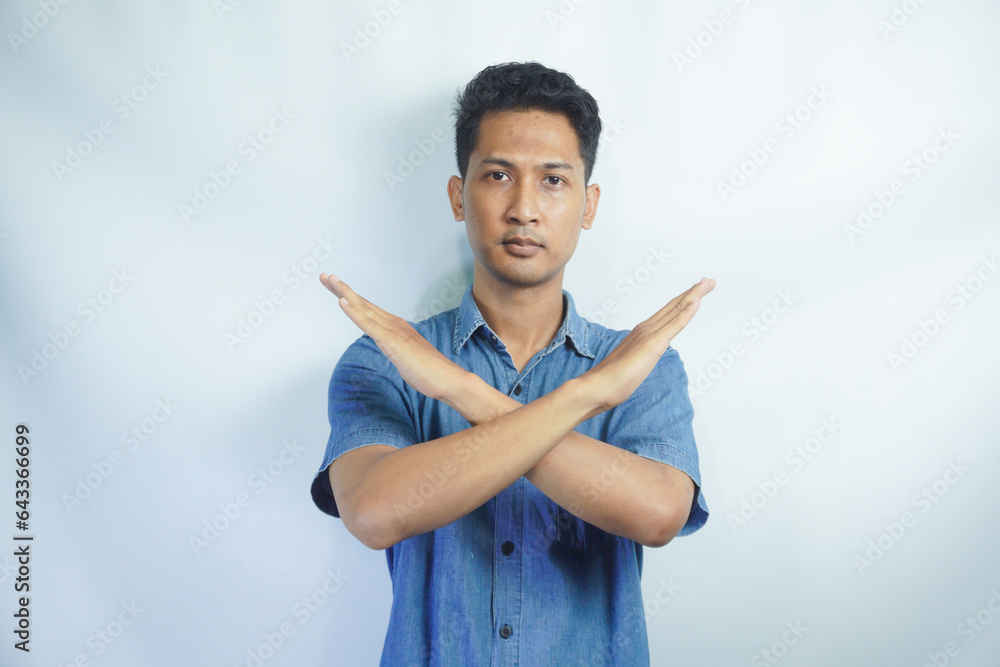 Asian person showing x shape gesture with hands, expressing refusal and ...