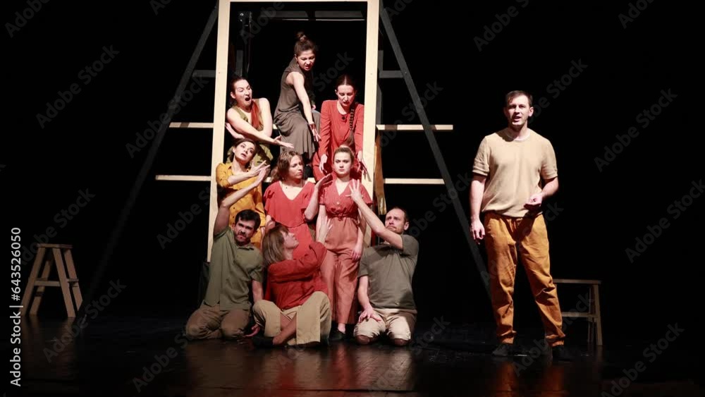 Actors and actresses perform a modern performance on the stage of the ...