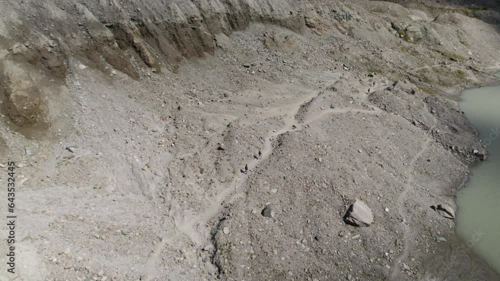Drone shot of Pasterze Glacier hiking trail and wild landscape, People ...