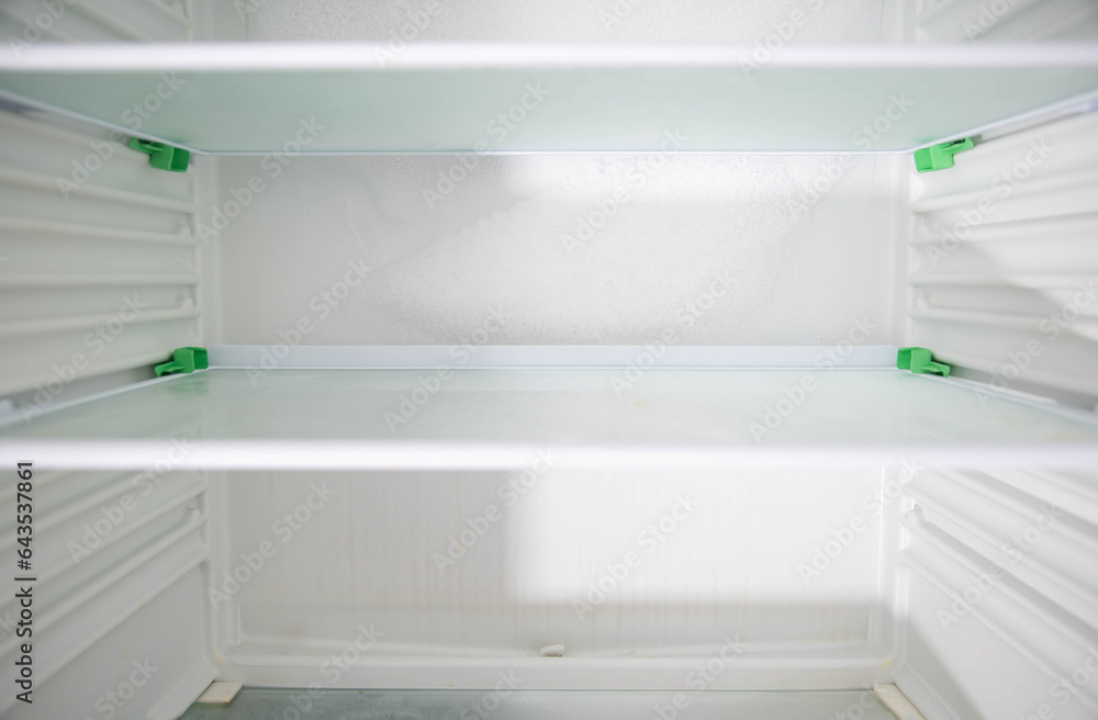 Ice and snow build up on the back wall of the refrigerator ...