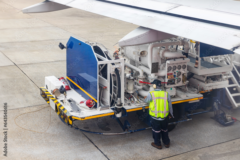 Aircraft refueling by high pressure fuel supply truck by officer ...