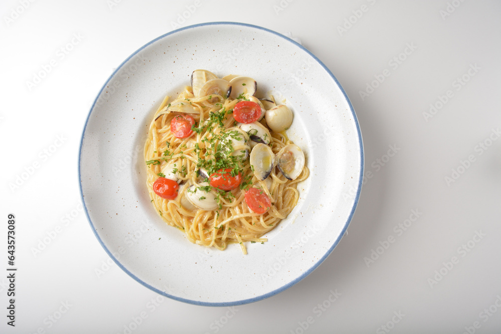 stir fried olive oil mixed seafood clam shell pasta in aglio olio style ...