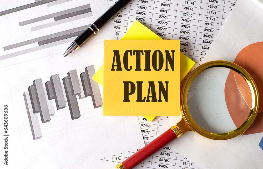 ACTION PLAN text on a sticky on the graph background with pen and magnifier Photos | Adobe Stock