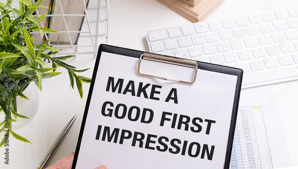 Business woman holding a white card with text Make a good first ...
