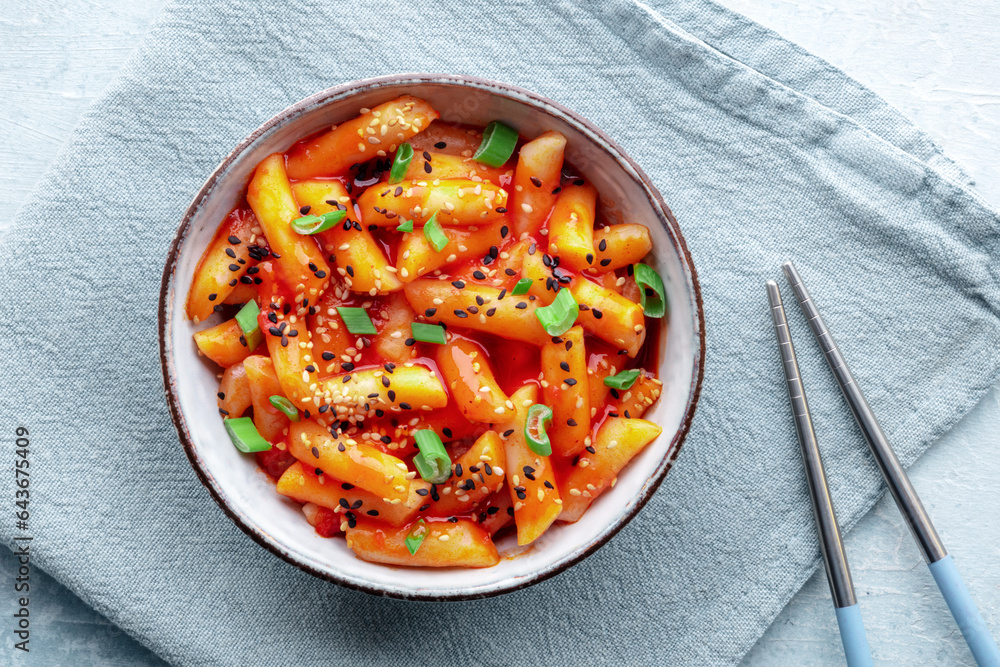 Tteokbokki or topokki, Korean street food, spicy rice cakes in red ...